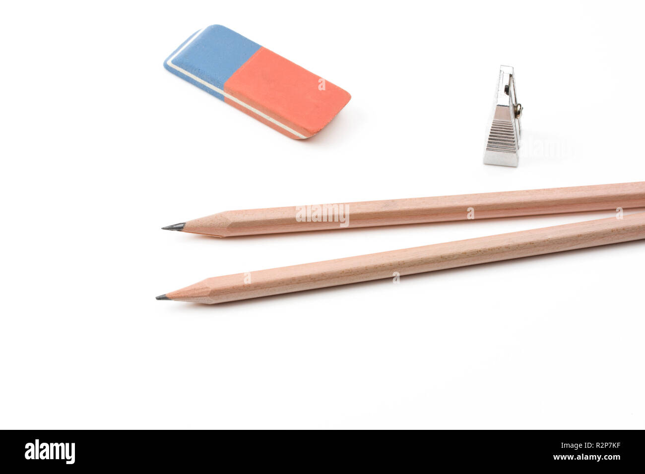 a pen,a sharpener and an eraser Stock Photo - Alamy