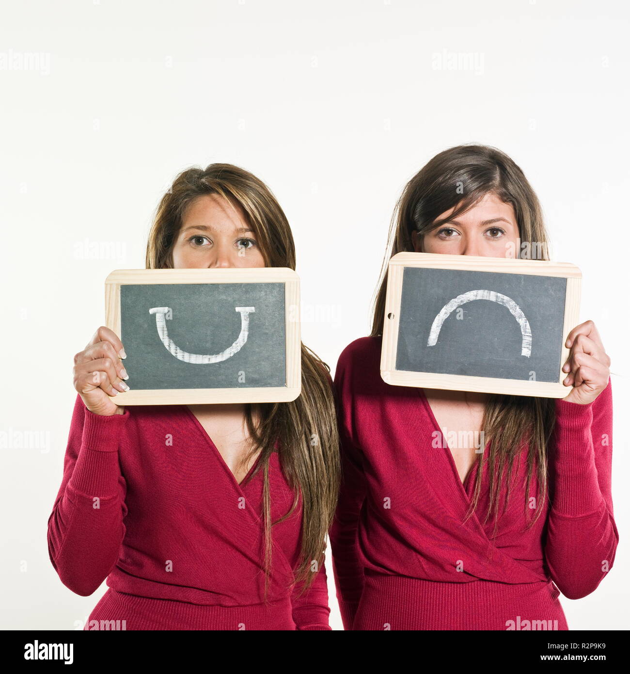 Woman twin happy sad hi-res stock photography and images - Alamy