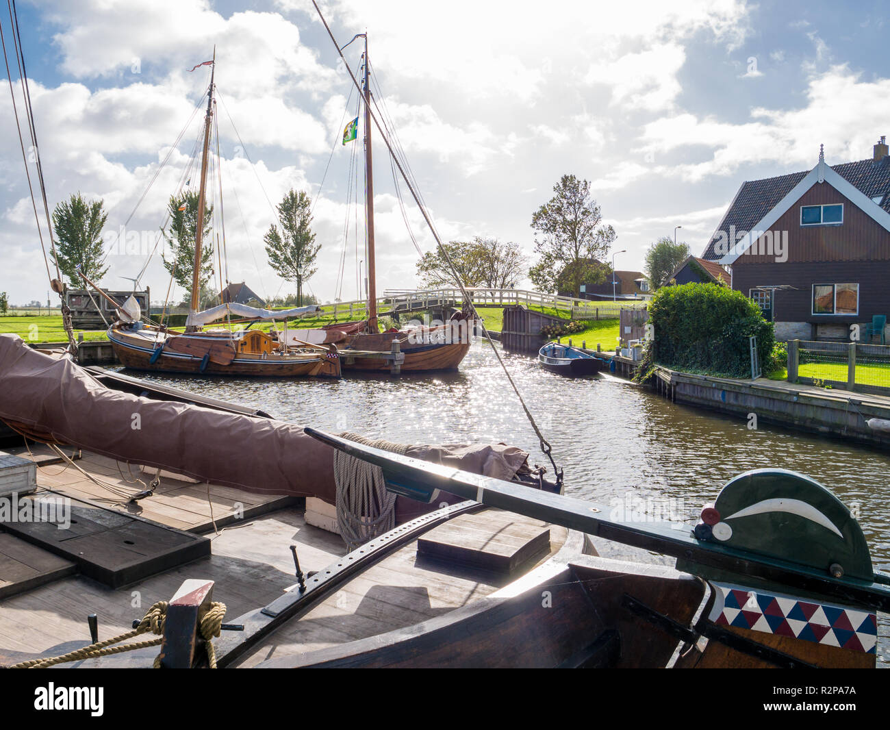 Traditional boats in historic harbour of city of Workum, Friesland ...