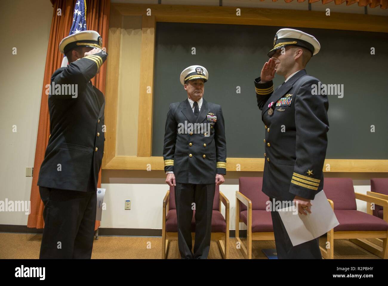 BANGOR, Wash. (Nov. 02, 2012) Cmdr. Cannon Neslen, right, is properly ...
