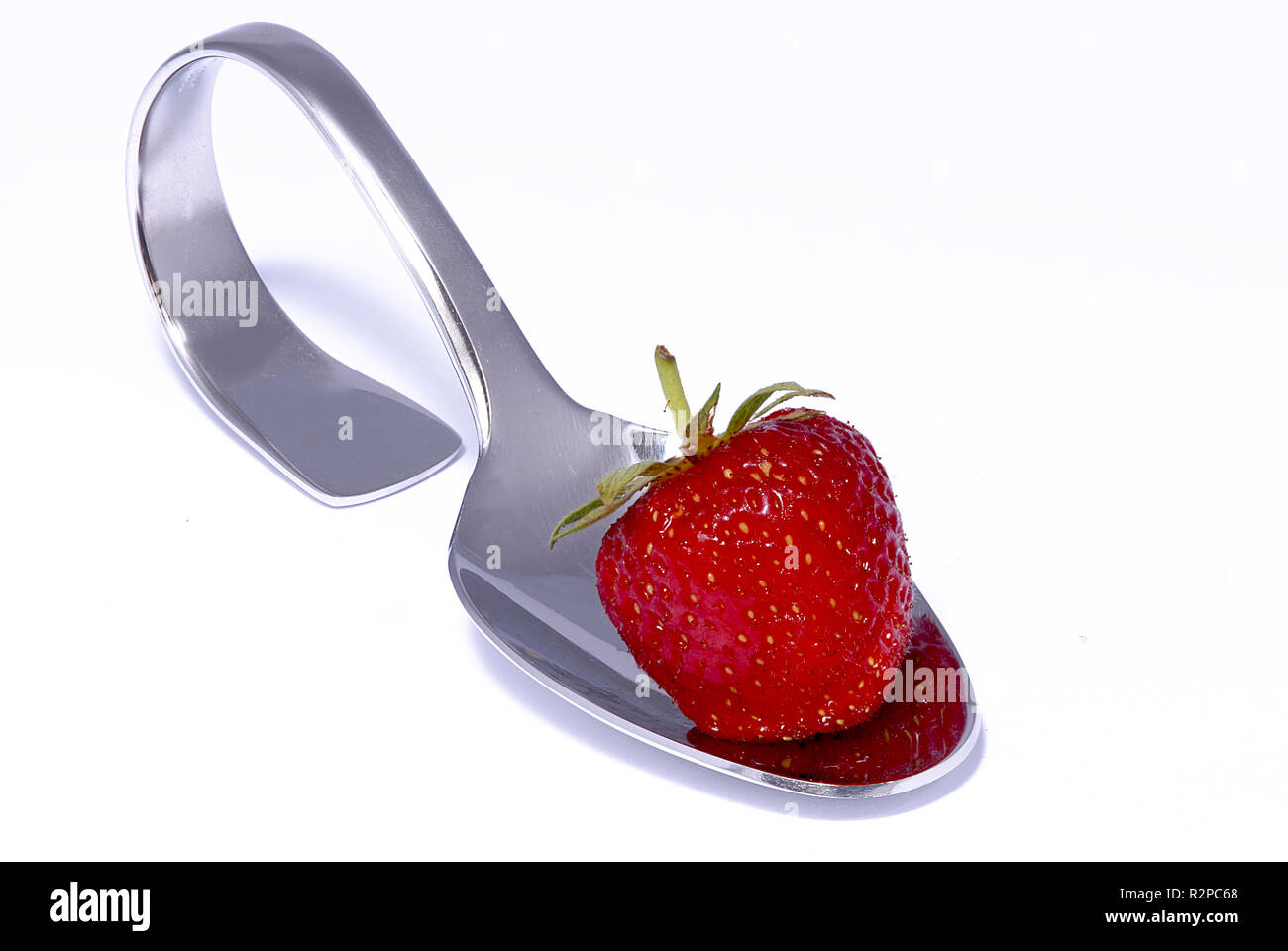 strawberry on spoon Stock Photo - Alamy