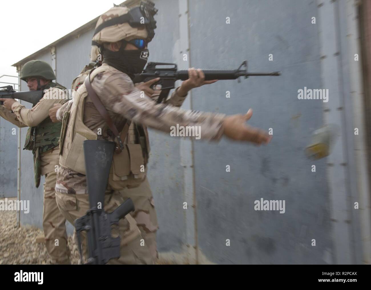 An Iraqi soldier assigned to the Besmaya Range Complex throws a ...