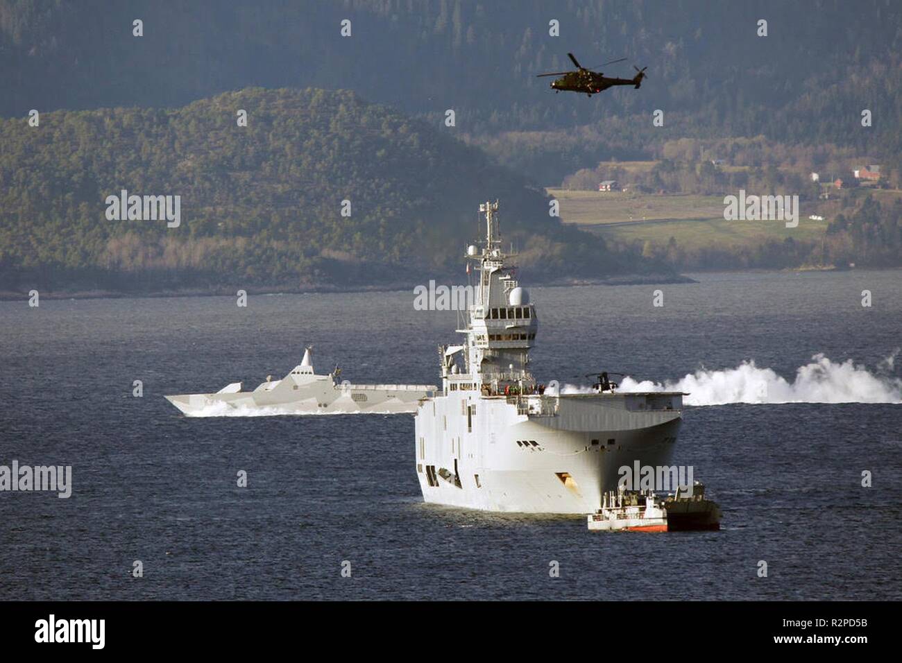 French amphibious ship FS Dixmude lauches helicopters and landing craft ...