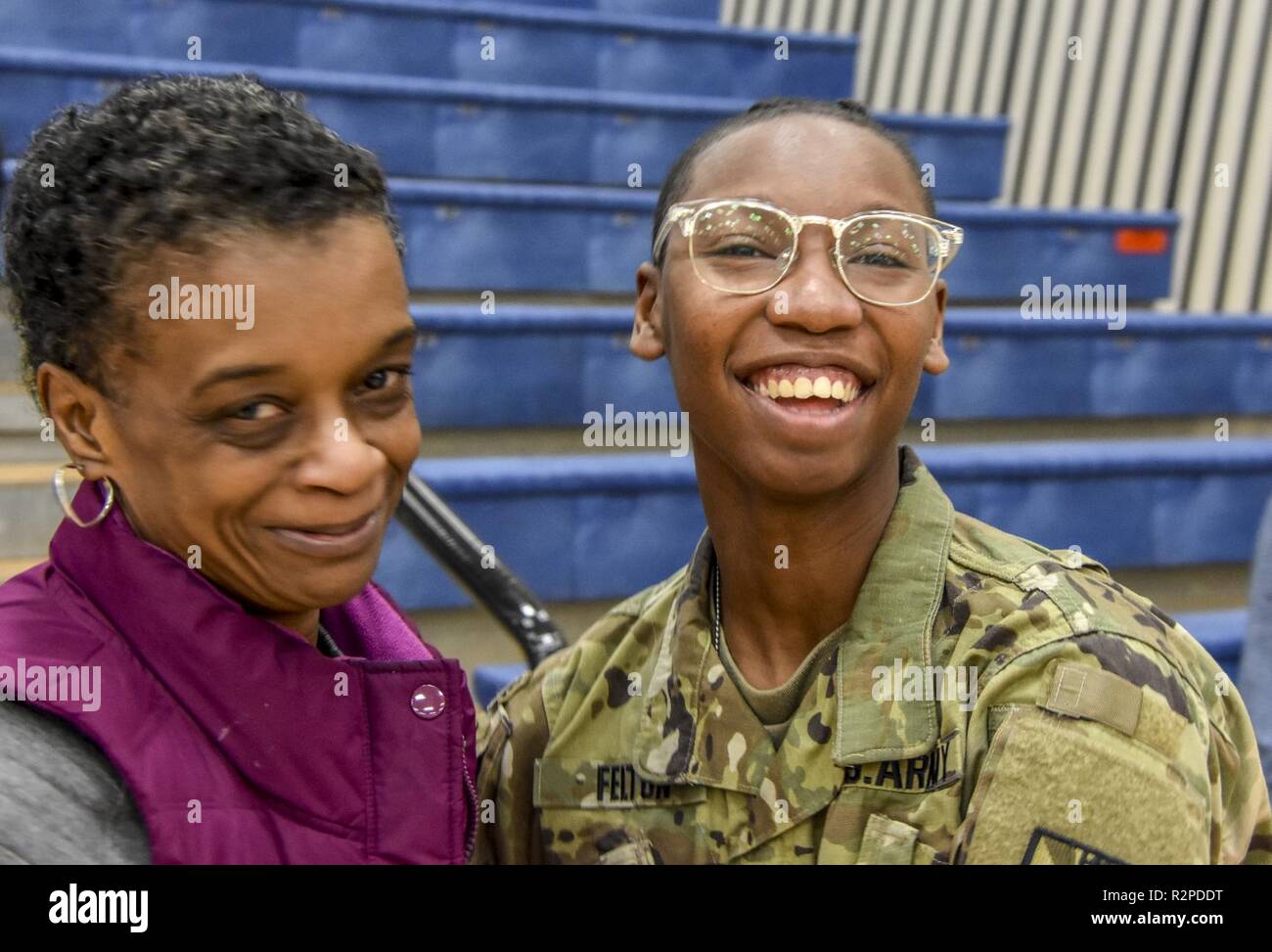 A Soldier says, "Good-bye" to her mother at a deployment ceremony for ...