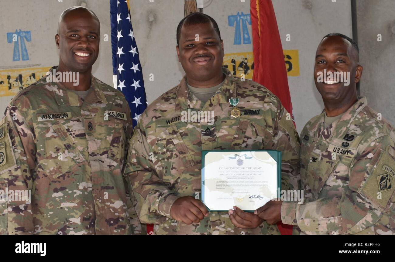 Sgt. 1st Class Derrick Wade is presented with his Army Commendation ...