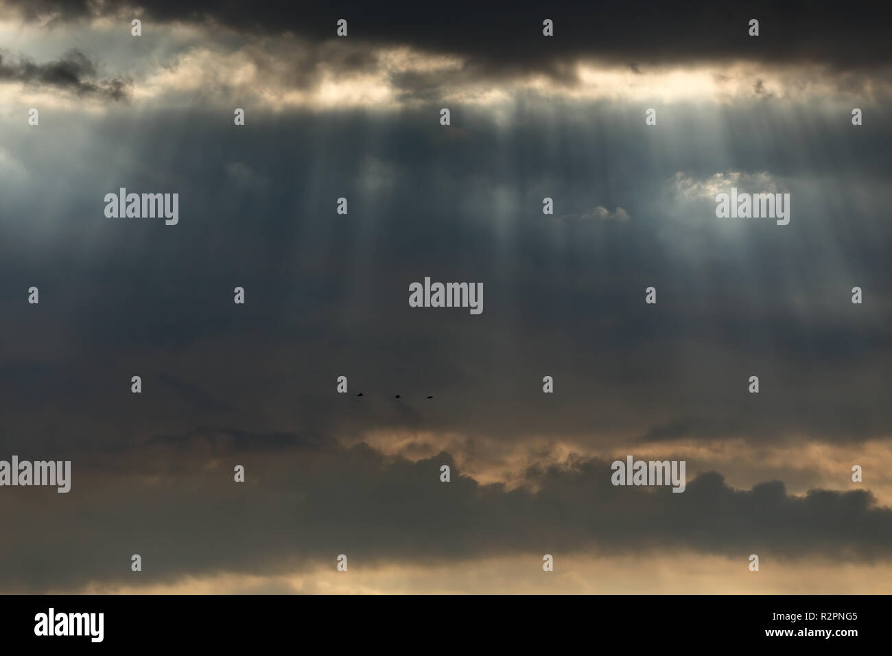 Early spring cloudy sky with natural sunbeams Stock Photo - Alamy