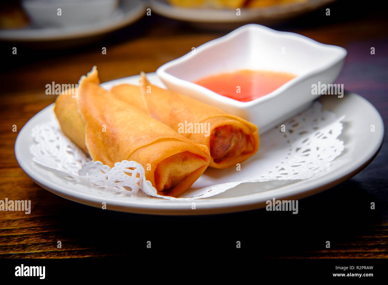 Chinese deep fried spring rolls with duck sauce Stock Photo - Alamy