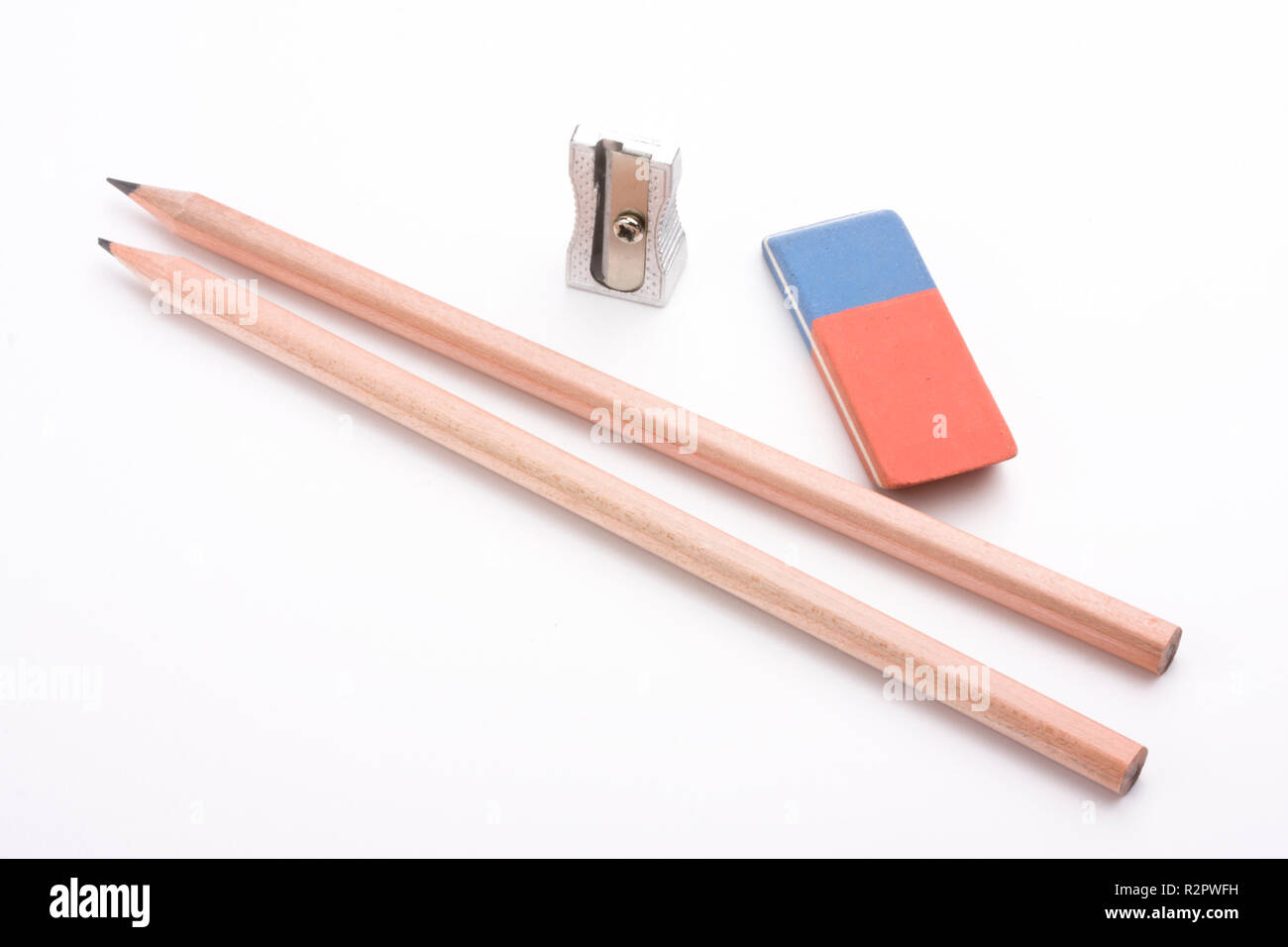 pencils,a sharpener and an eraser on a white background Stock Photo - Alamy