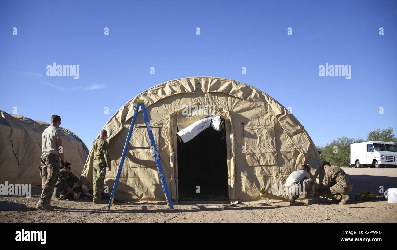 U.S. Air Force Airmen work together to set up tents for Sunglow City at ...