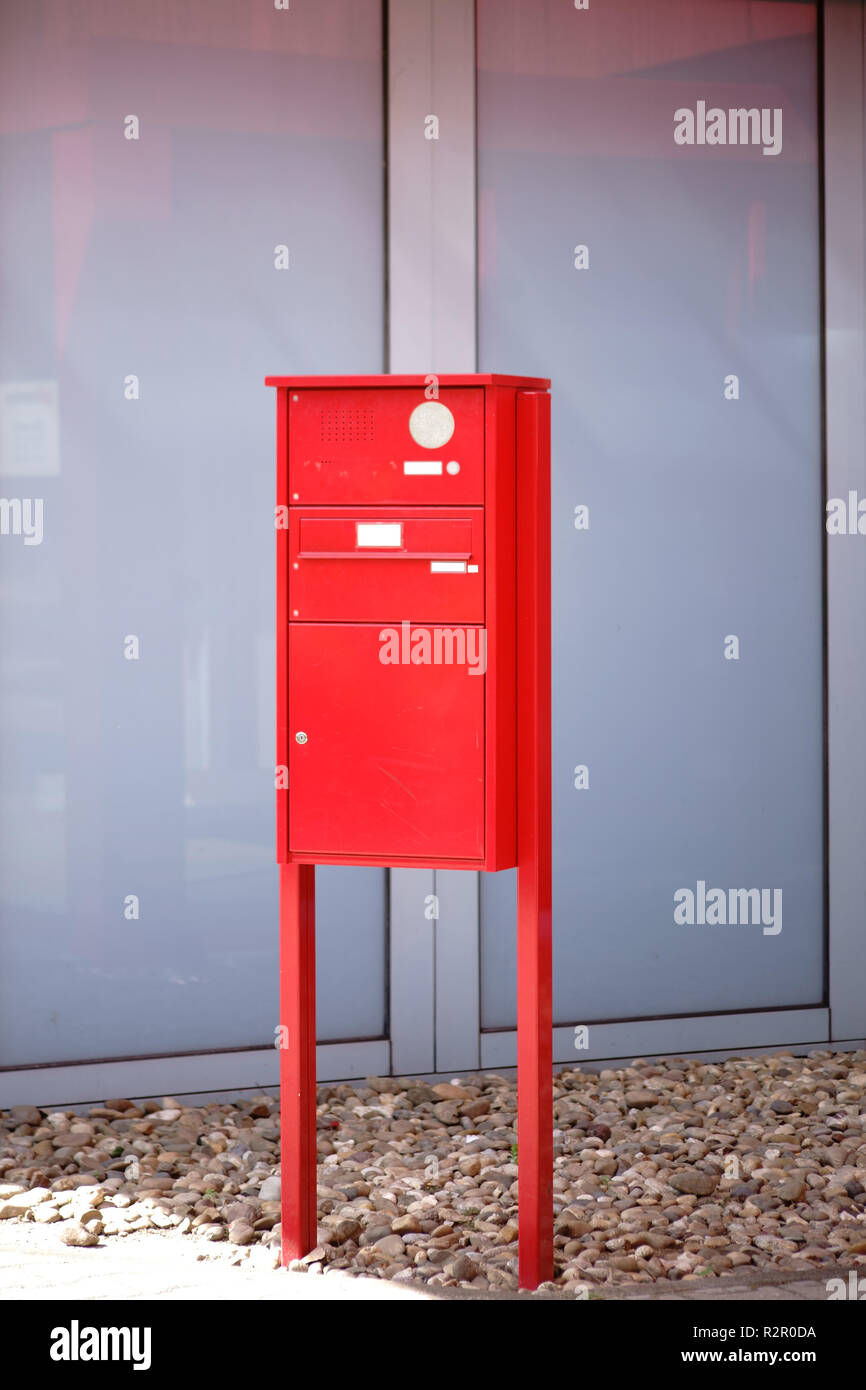 Bright red letter box with bell and intercom Stock Photo - Alamy