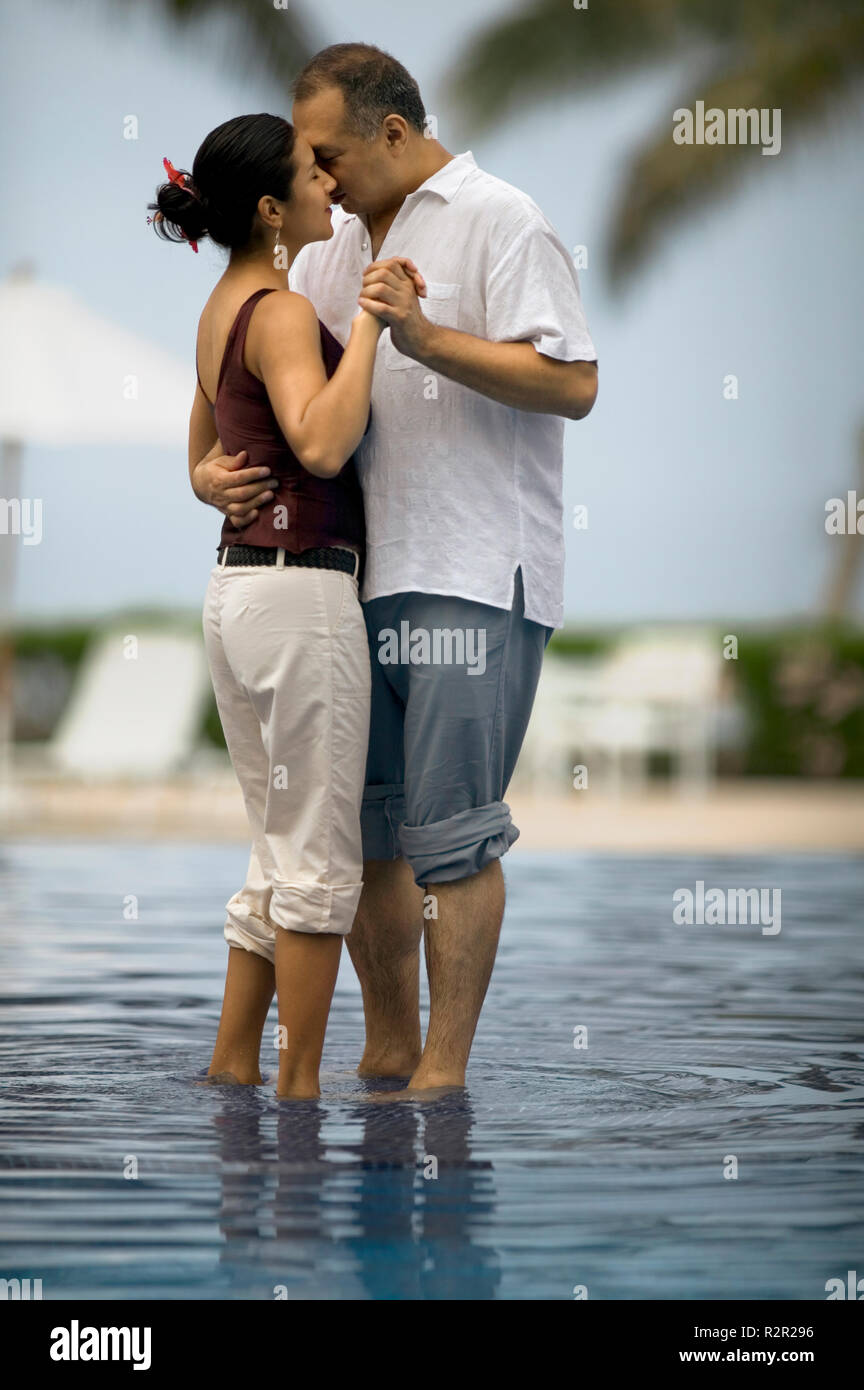 A couple is seen romanticizing in the swimming pool Stock Photo - Alamy