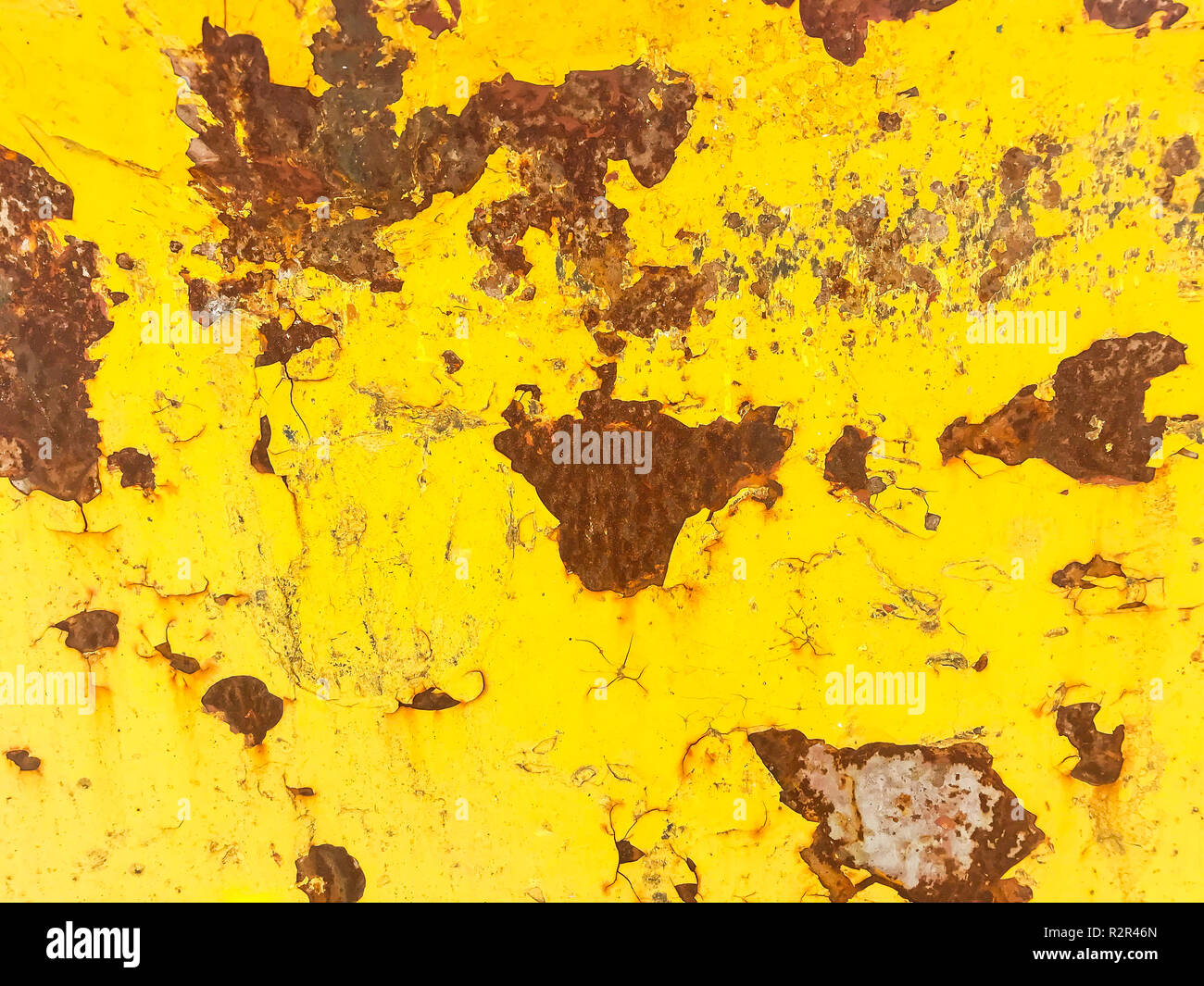 Rust on metal, painted in yellow paint. Studio Photo Stock Photo - Alamy
