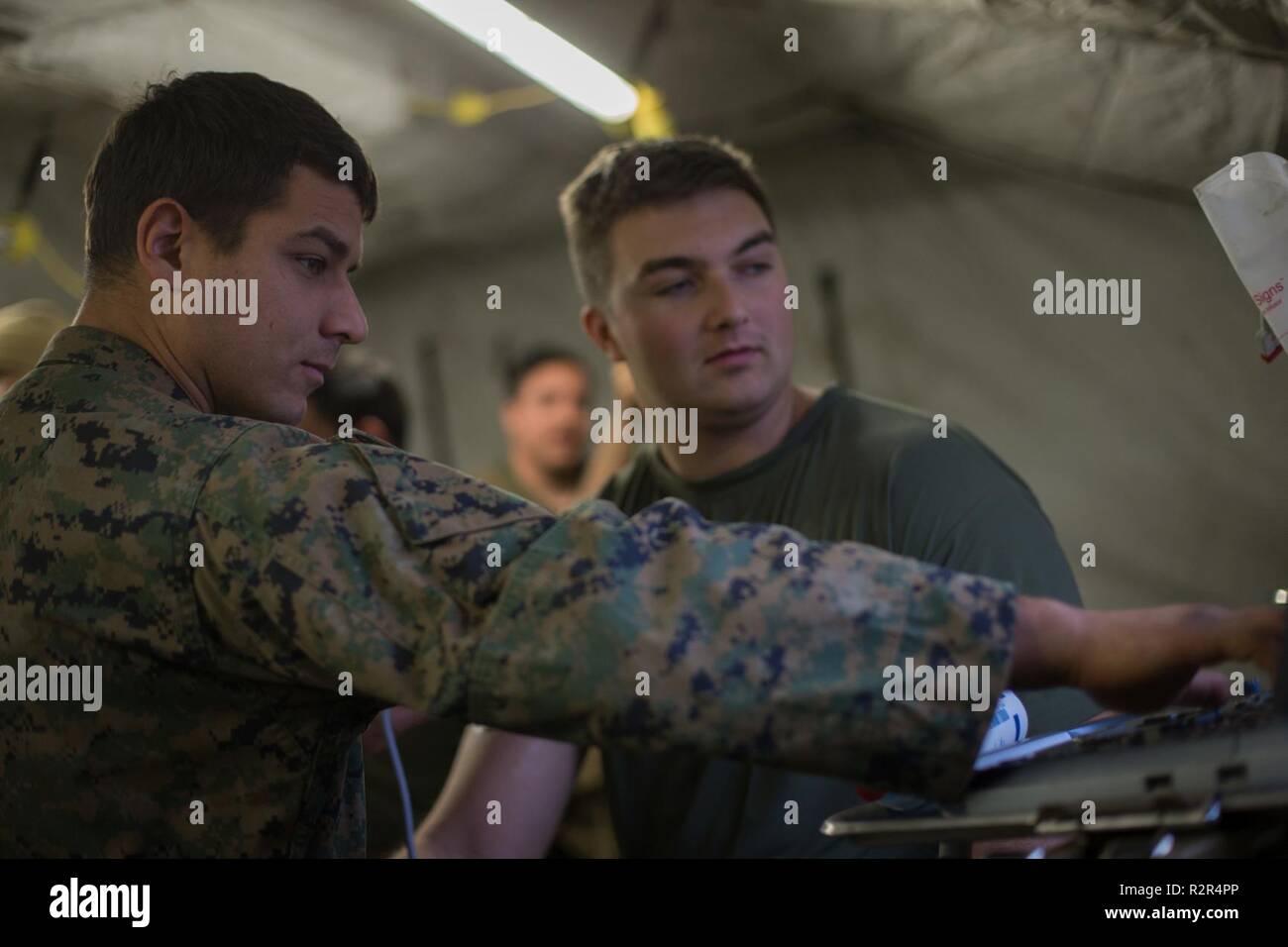 U.S. Navy Hospitalman 1st Class Nicholas Sleeman, left, and Hospitalman ...