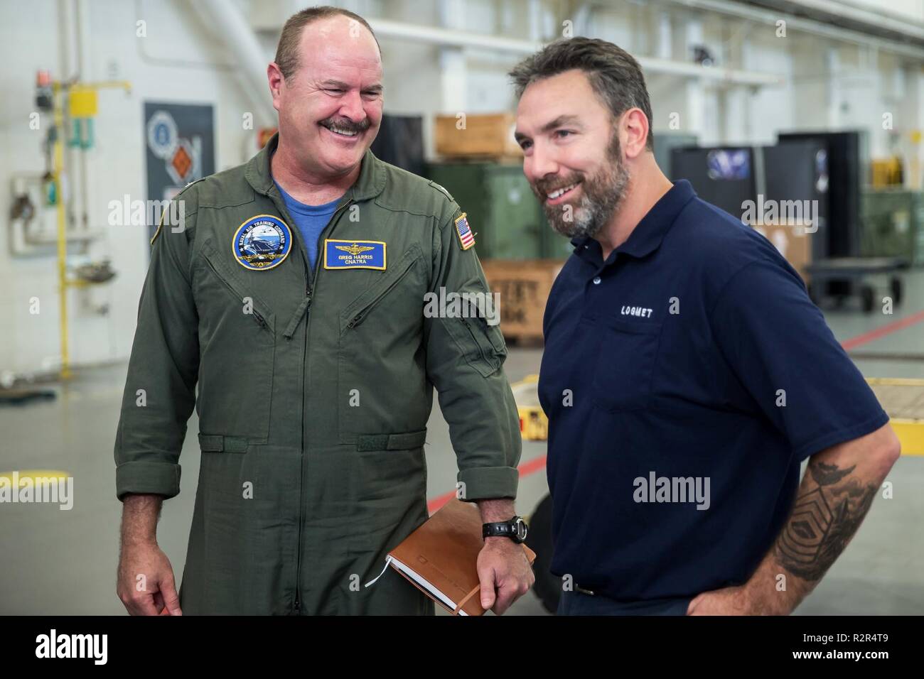 Eric Copp, right, sight lead, Logmet, briefs U.S. Navy Rear Adm. Greg ...