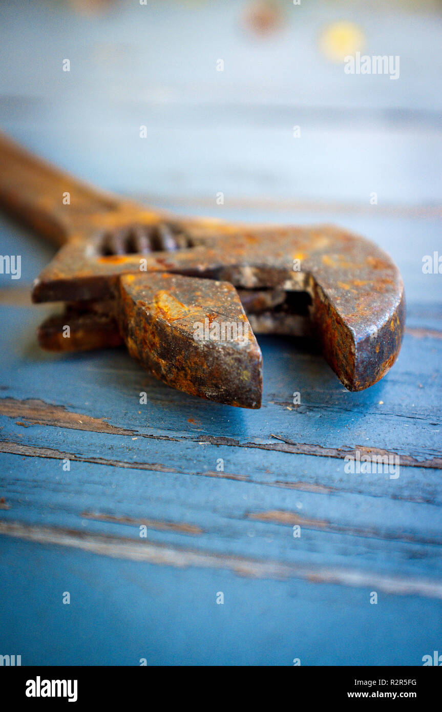 Old rusty adjustable wrench contractors tool on worn wooden floor Stock ...