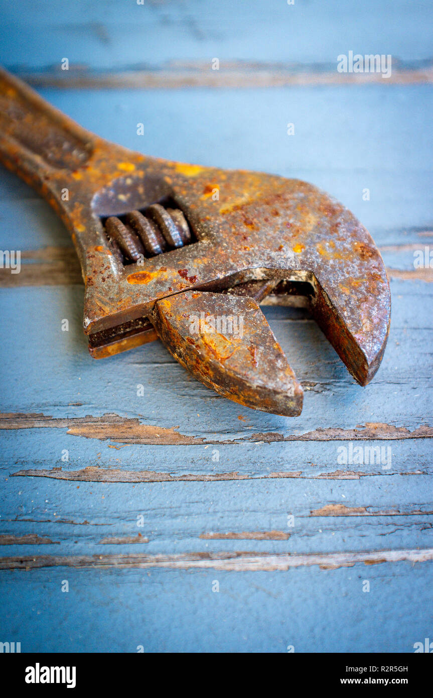 Old rusty adjustable wrench contractors tool on worn wooden floor Stock ...
