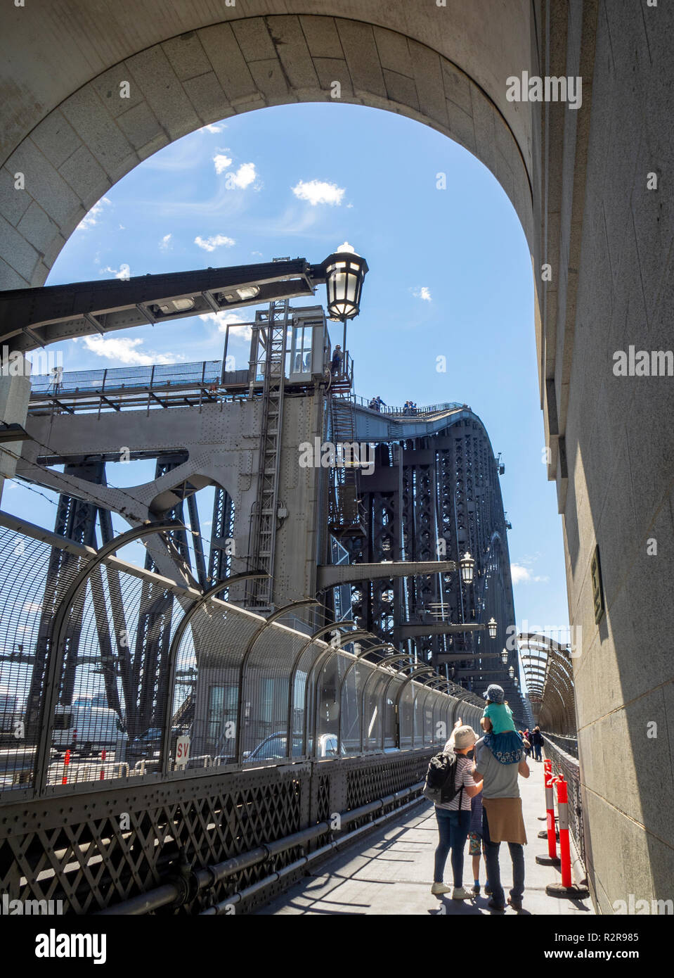 Pedestrians walking across the Sydney Harbour Bridge NSW Australia ...