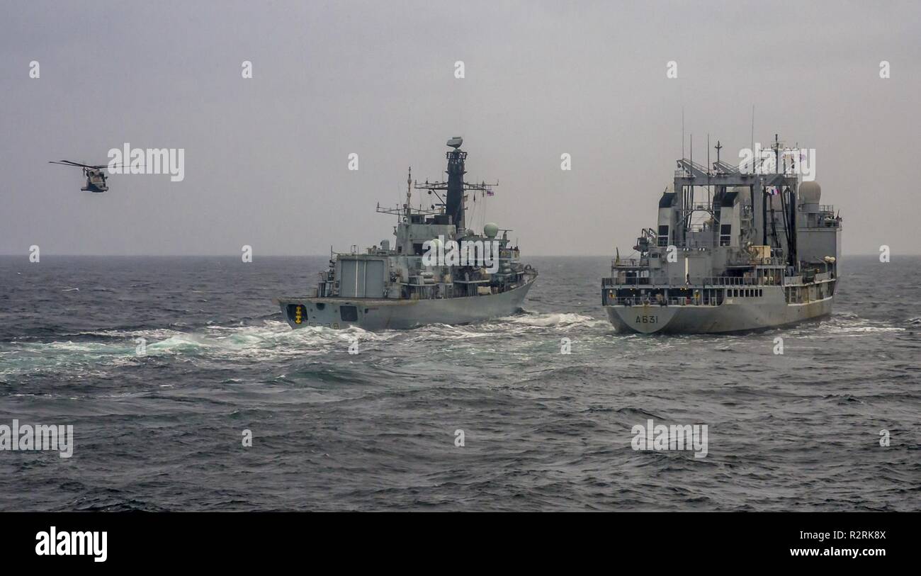 Her Majesty's Ship (HMS) WESTMINSTER (Center), E238, performs a ...