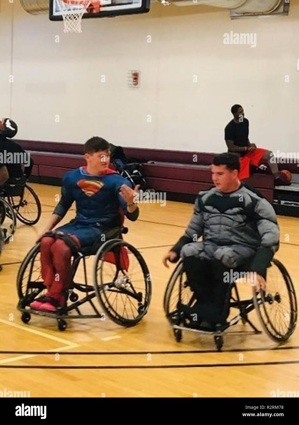 Spc. Trevor Hunter, dressed as Batman, and Spc. Drew Joyner dressed as ...