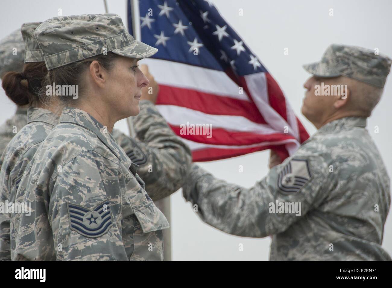 U.S. Air Force Tech. Sgt. Kim Wade prepares to recieve the flag during ...