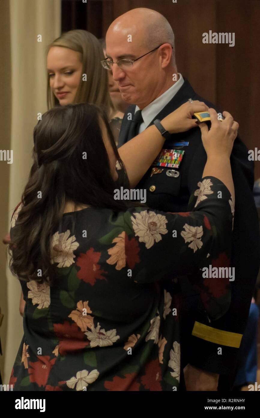 Indiana National Guard Col. Robert D. Burke has his wife, Tina, remove ...