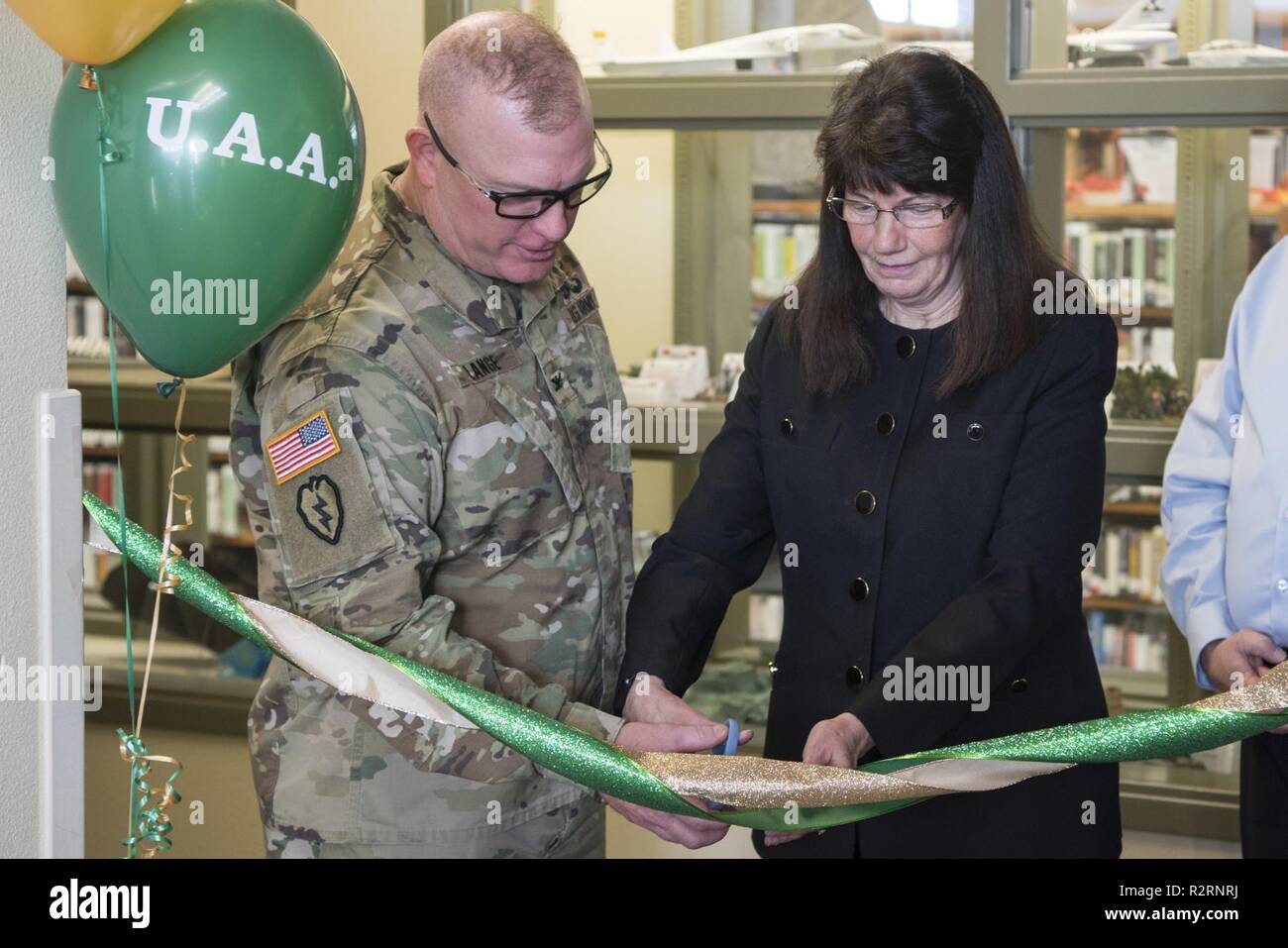 U.S. Army Col. Adam Lange, 673d Air Base Wing vice commander, and Renee Carter-Chapman ...