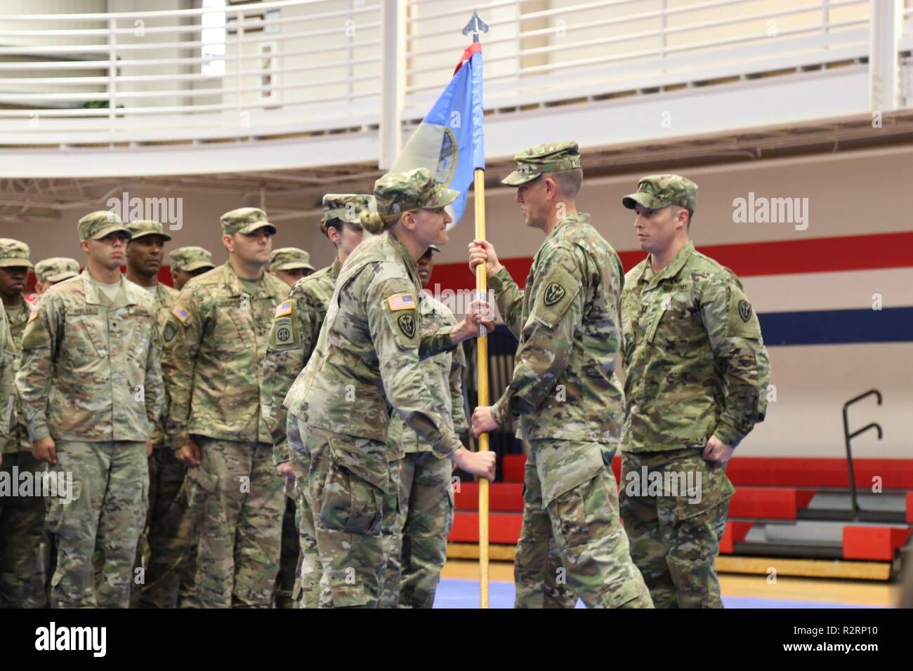 Lt. Col. Brian Hawkins, right, passes the guidon to Capt. Sarah ...