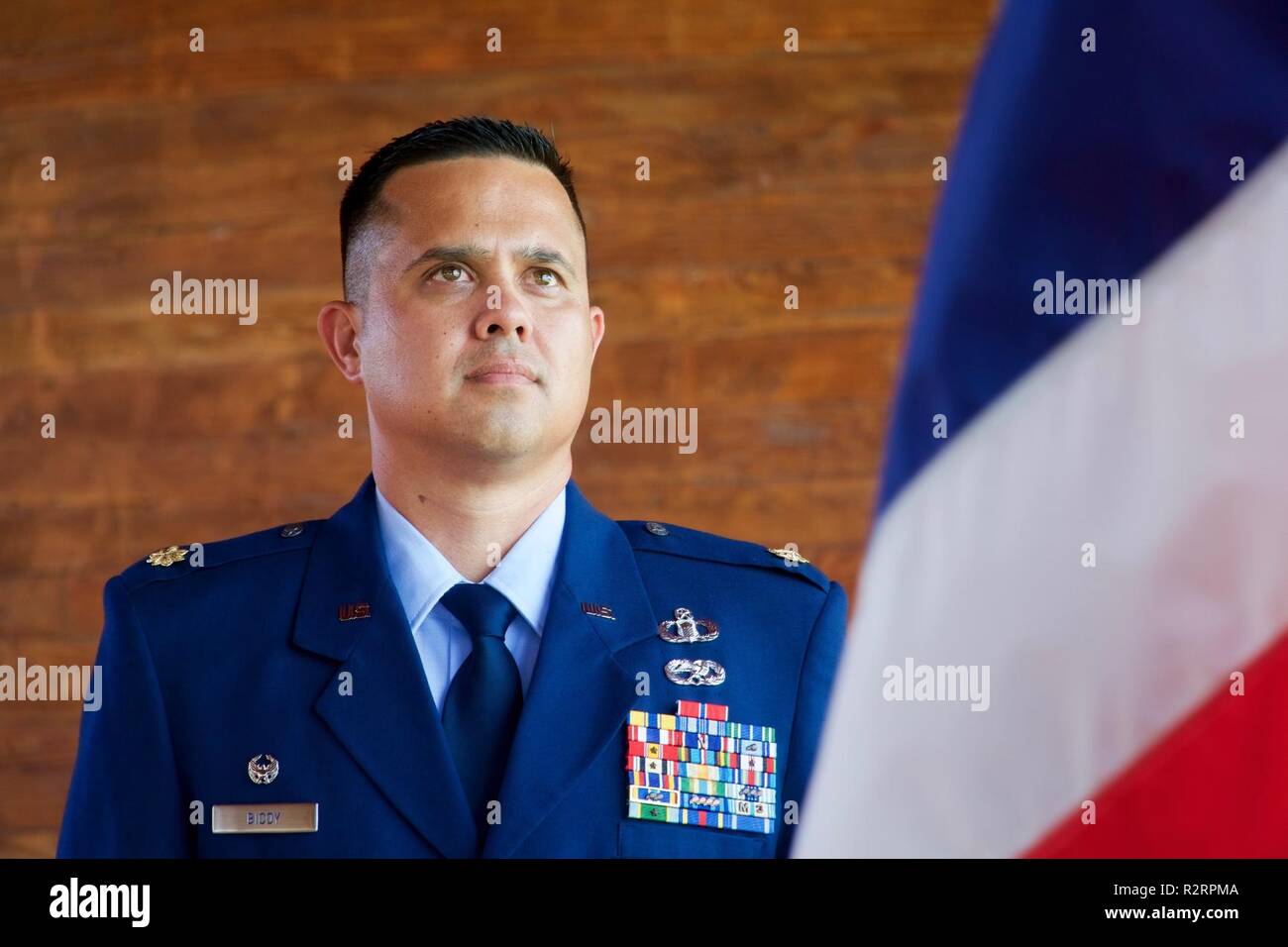 U.S. Air Force Maj. Irving B. Bicoy II looks at the American flag ...