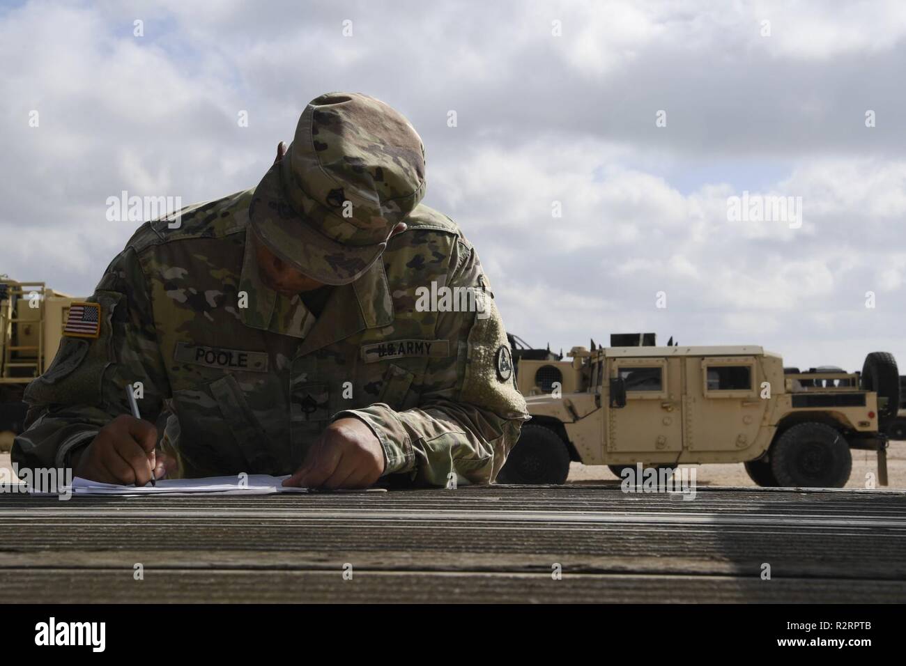 A Soldier takes inventory of vehicles being transported into Donna LSA ...