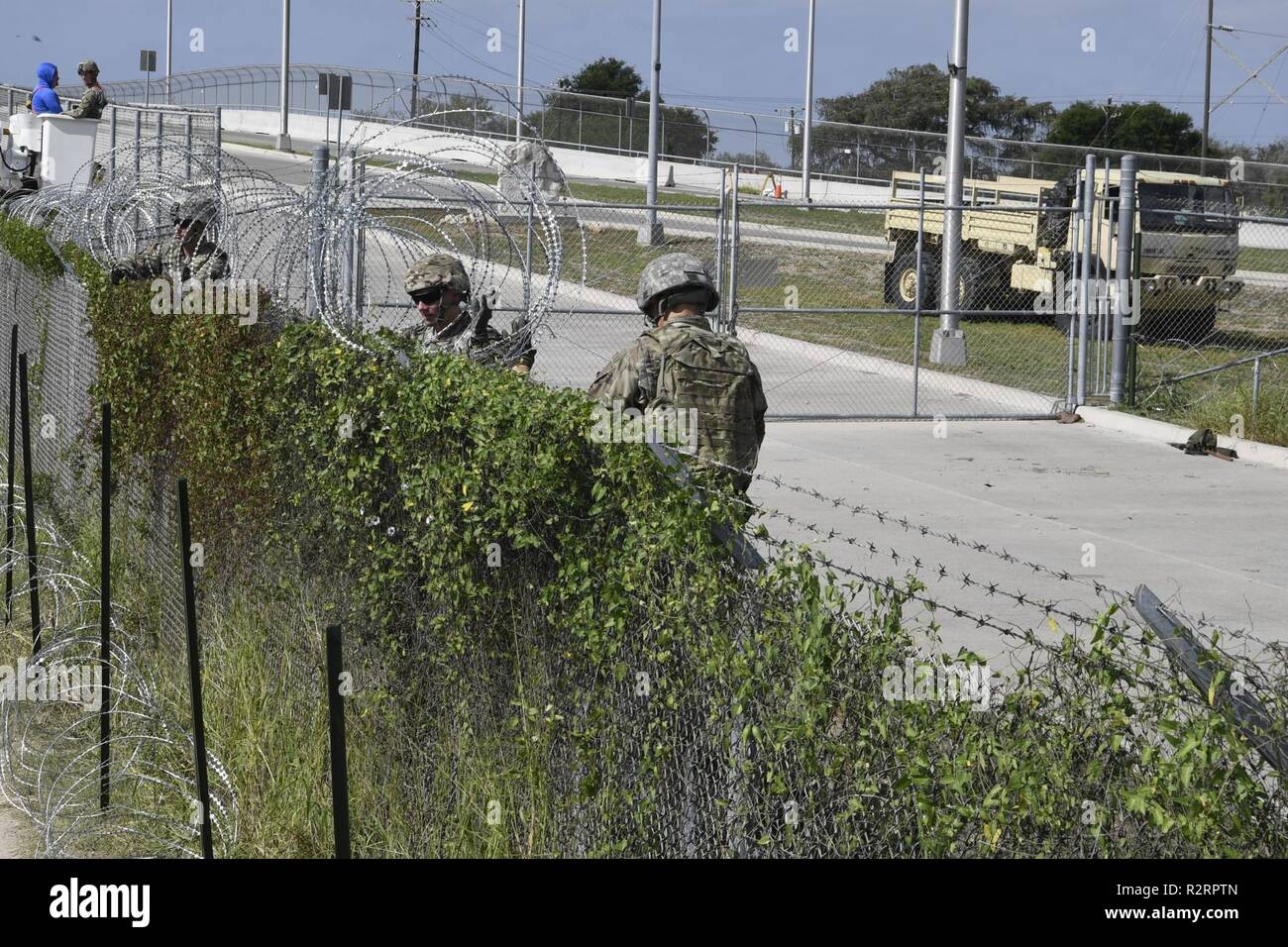 Soldiers with the 541st Sapper Company, install concertina wire on a ...