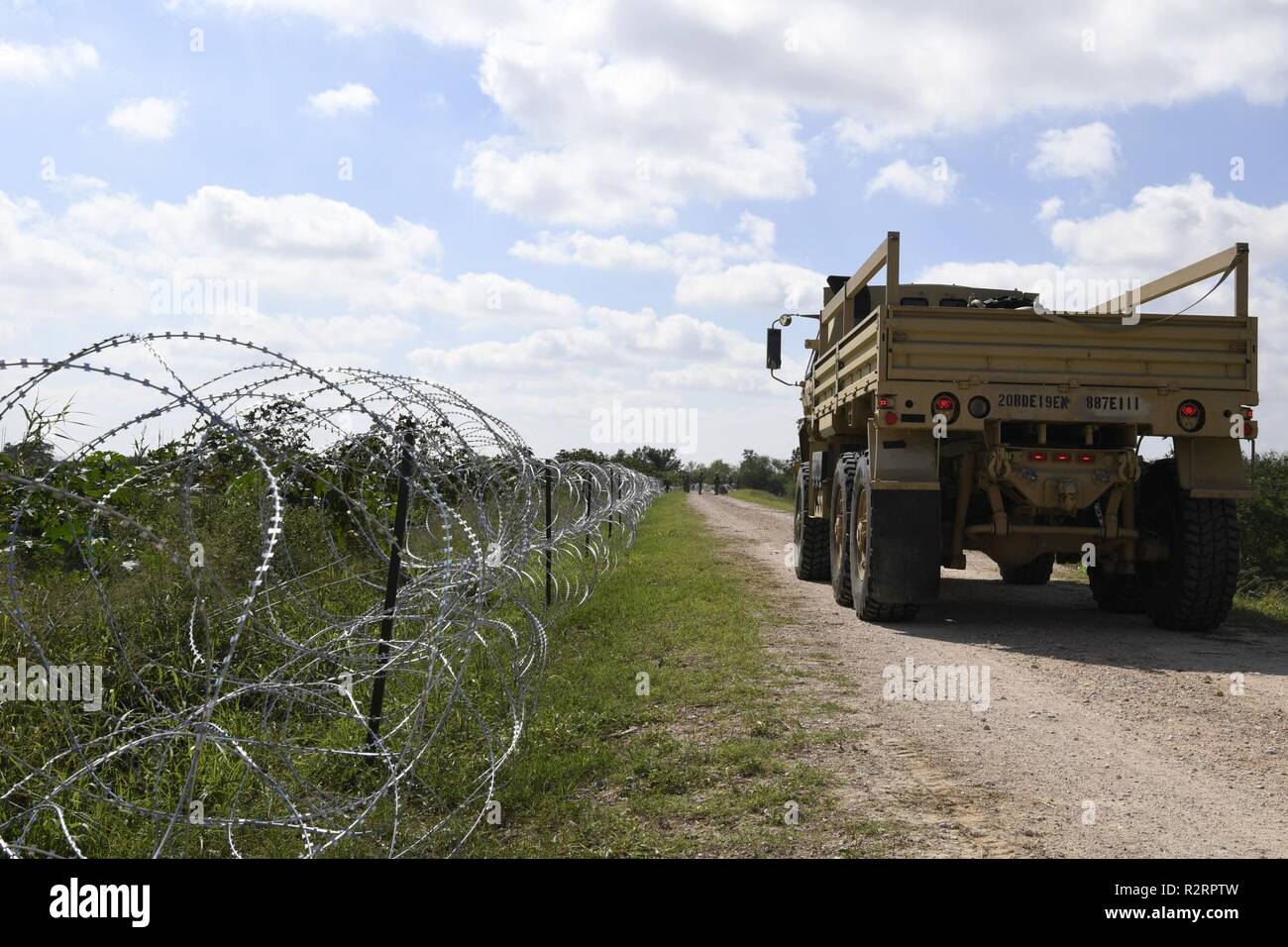 Soldiers with the 541st Sapper Company, install concertina wire Nov. 6 ...