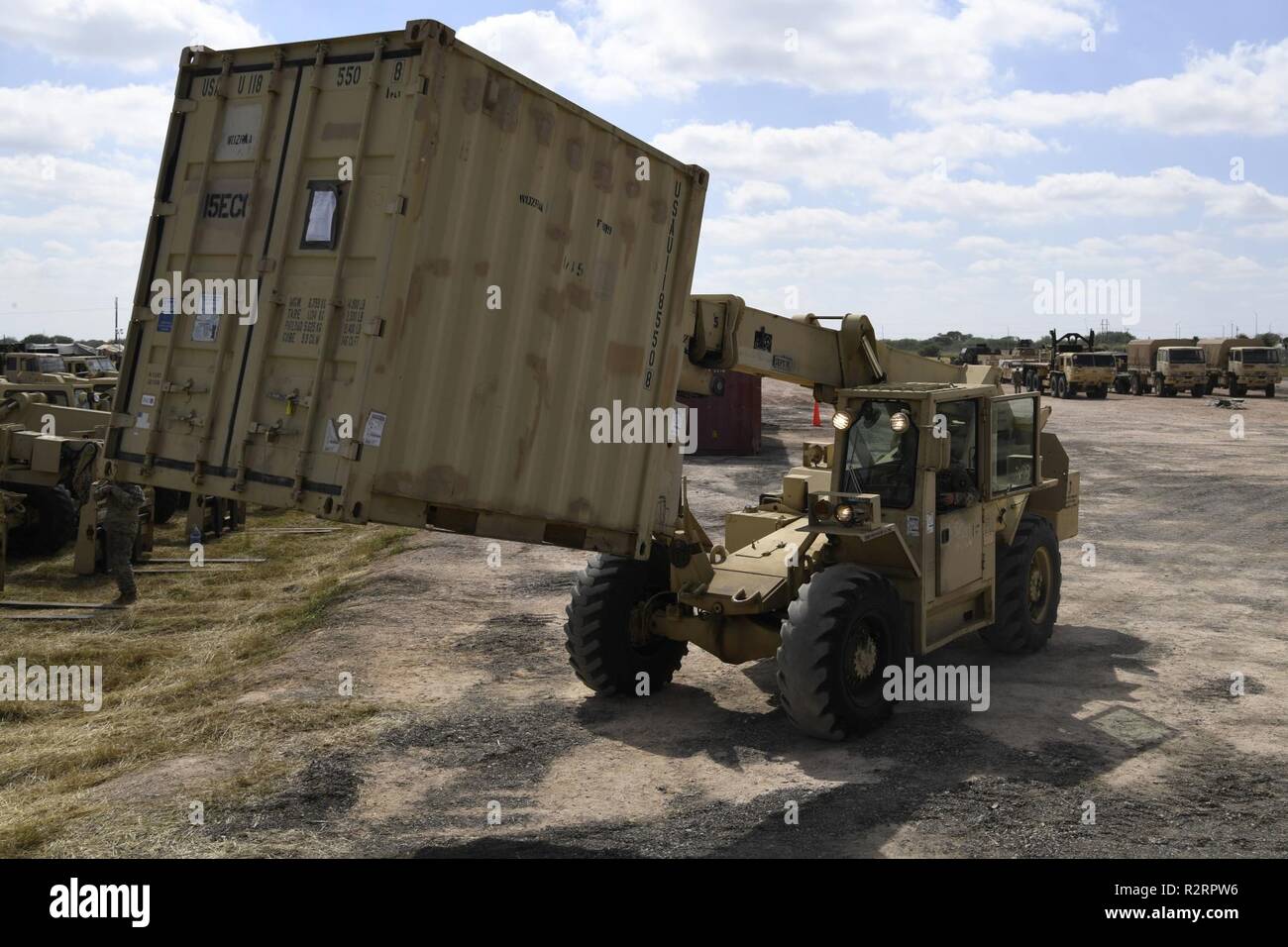 A Soldier operates a forklift carrying a supply container Nov. 6, 2018 ...