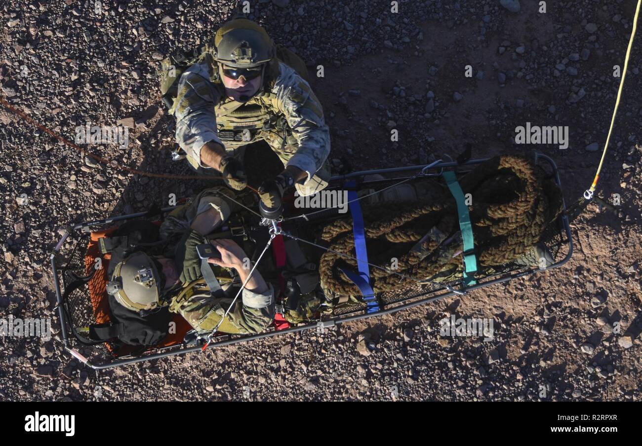 A U.S. Air Force pararescueman with the 66th Rescue Squadron fastens a ...