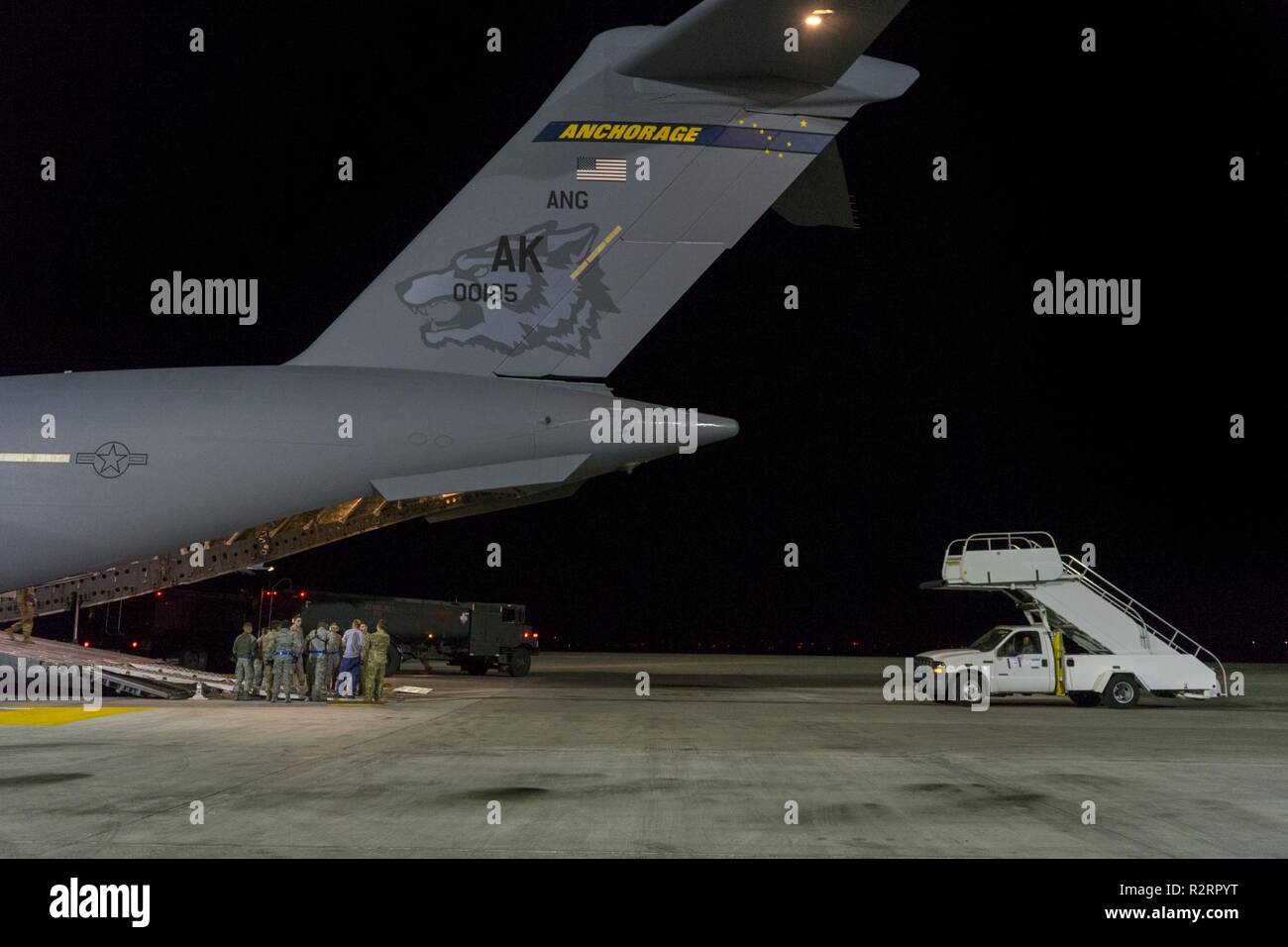 Airmen from the 60th Aerial Port Squadron discuss a plan for loading ...