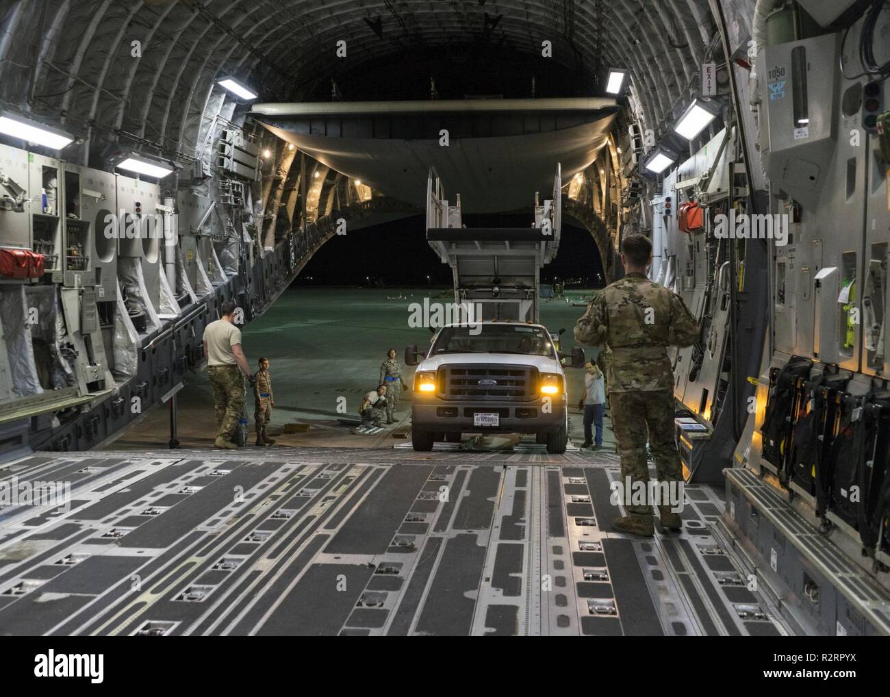 Airmen from the 60th Aerial Port Squadron load and secure aircraft ...