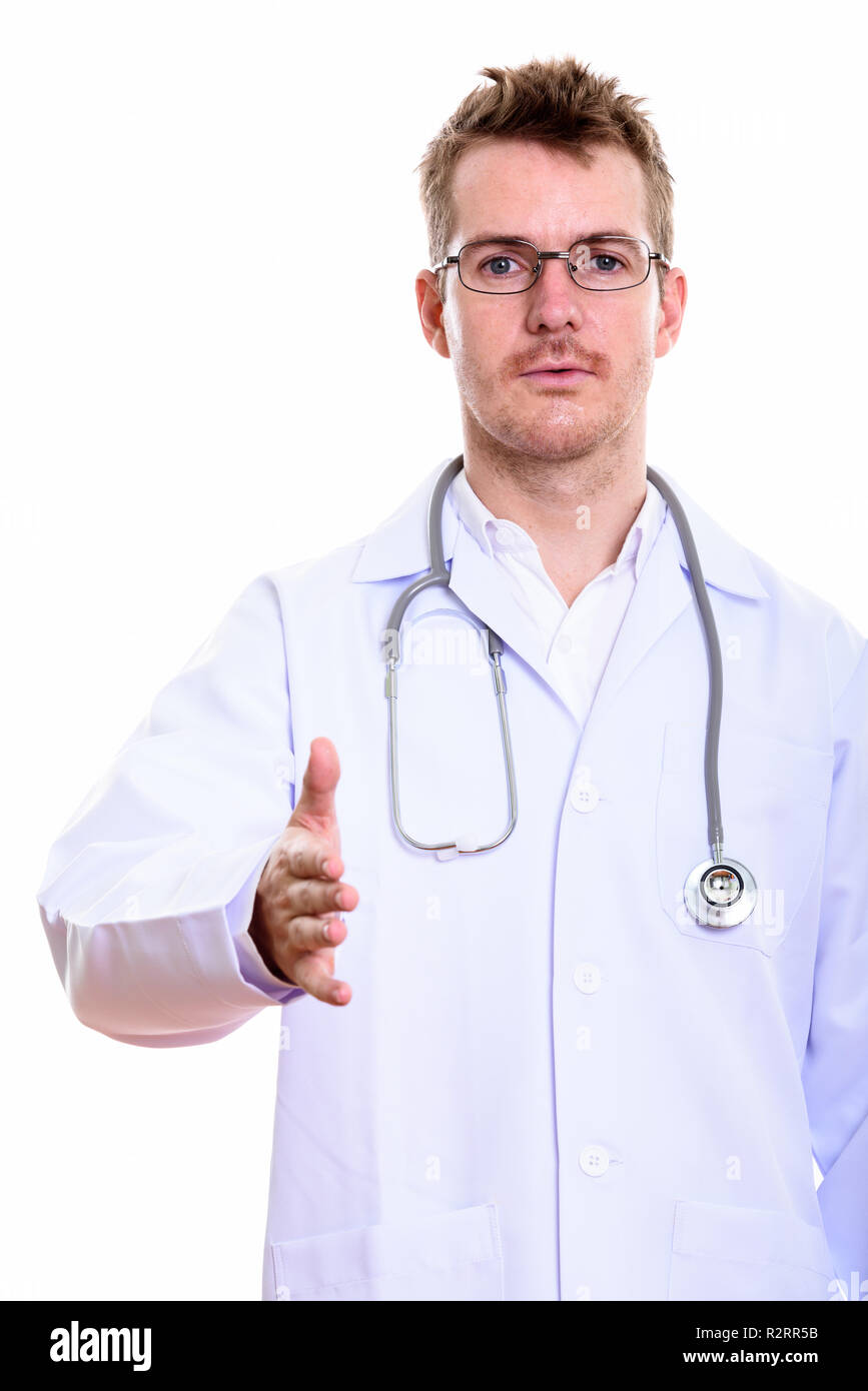 Studio shot of man doctor giving handshake Stock Photo - Alamy