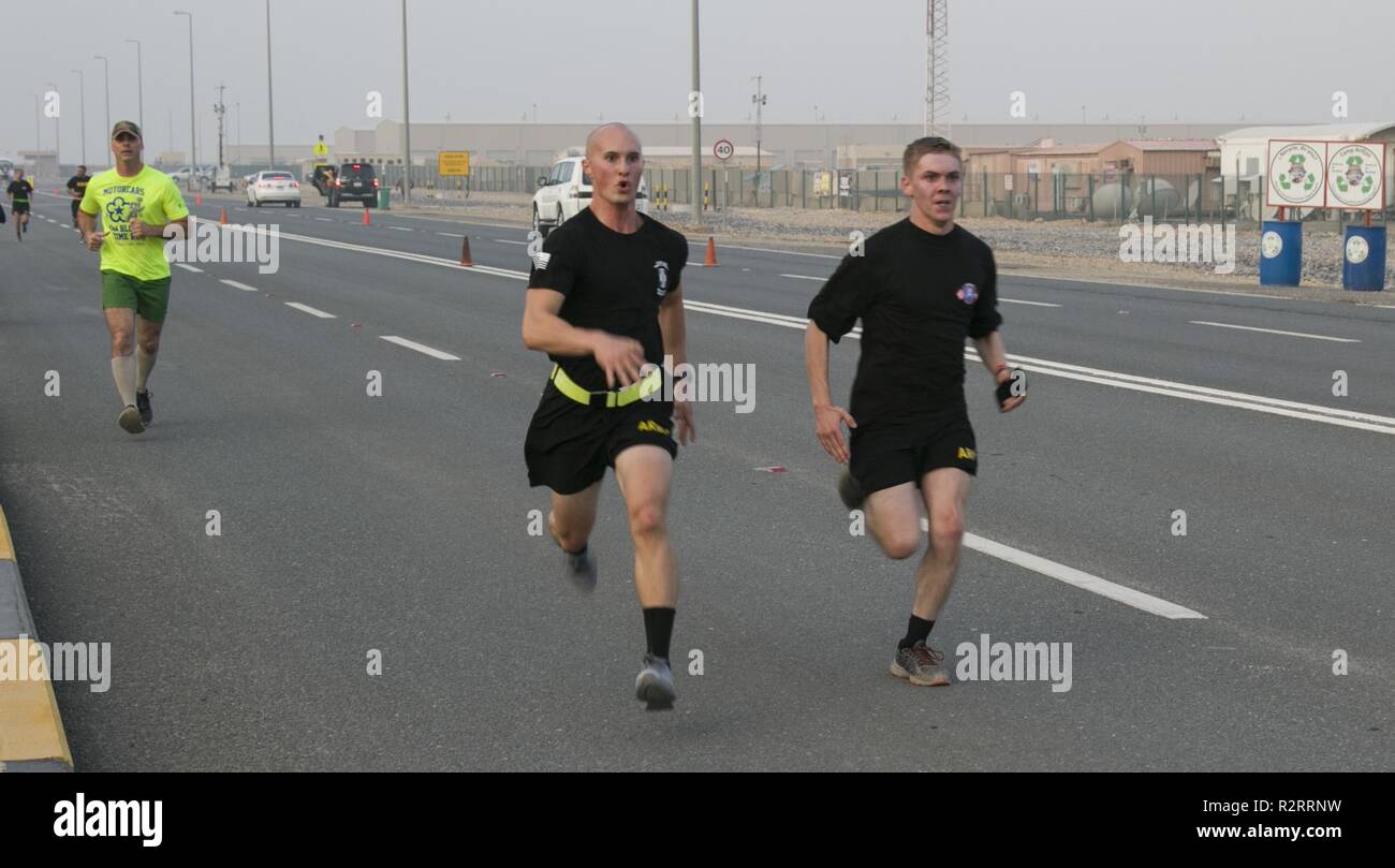 U.S. Army Central Soldiers race toward the 3-mile finish line during ...