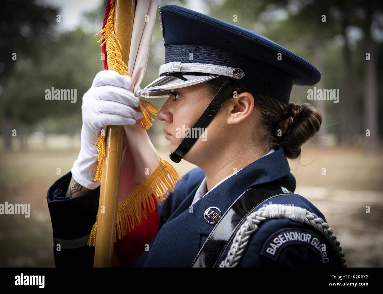 Airman 1st Class Amanda Cintron holds the Florida state flag prior to ...