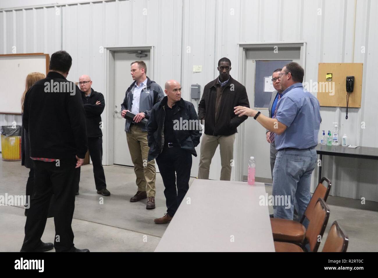 Members of a staff delegation visit, including Brigid Houton and John ...