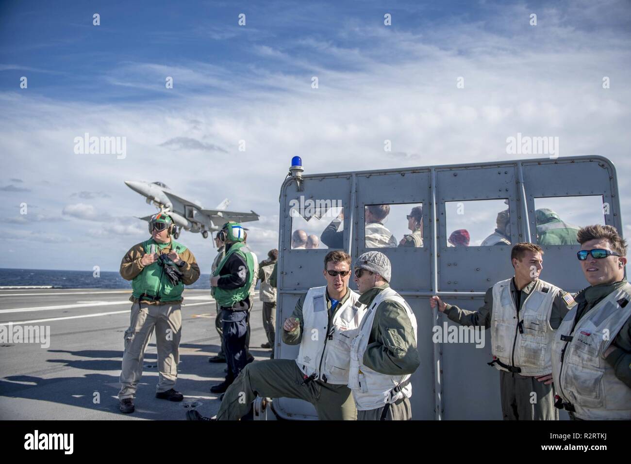 ATLANTIC OCEAN (Nov. 3, 2018) Sailor observe flight operations from the ...