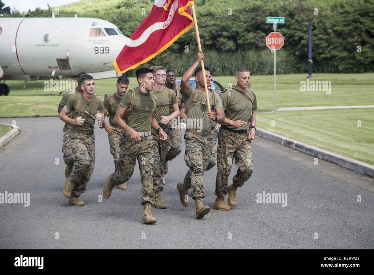 U.S. Marines from Marine Air Group 24 run in honor of the 243rd Marine ...