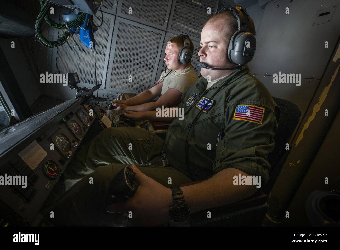 U.S. Air Force Senior Airman Chris M. Borgia, back, a crew chief with ...