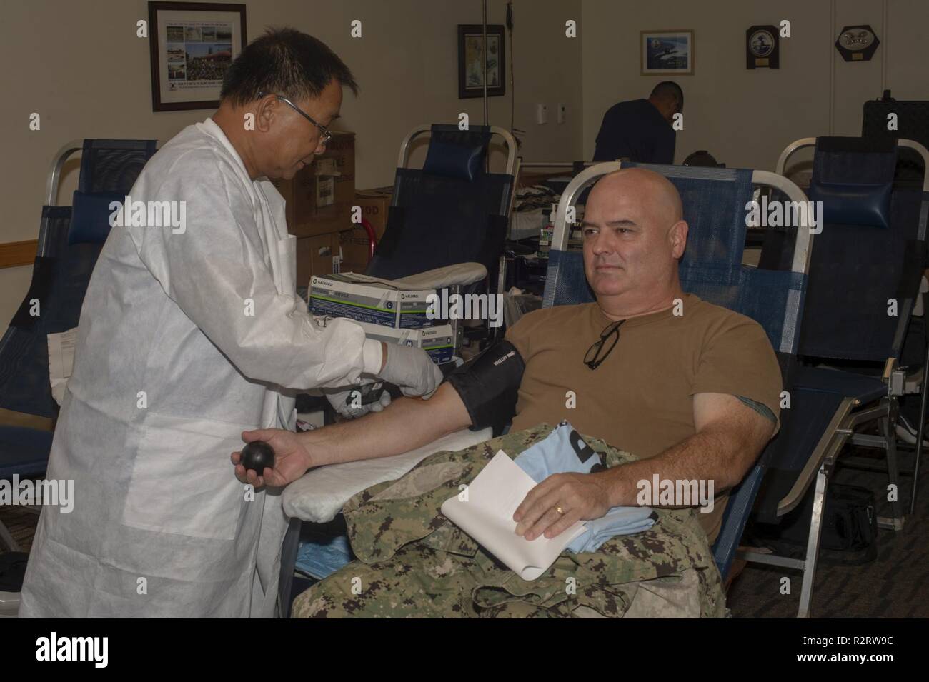 Capt. Timothy Poe, commander, Submarine Squadron (SUBRON) 15, donates ...
