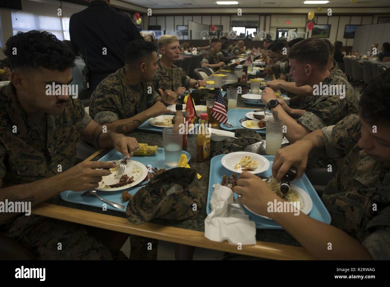 U.S. Marines eat food during a birthday lunch at the Anderson Chow Hall ...