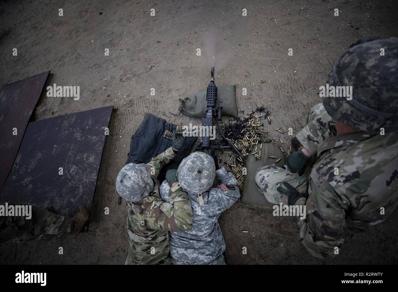 U.S. Army Soldiers from the 1-114th Infantry Regiment crew an M240 ...