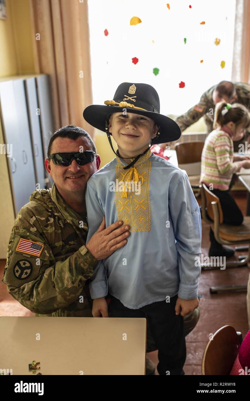 SM Nathan Escue poses with a child at the Academic Rehabilitation ...