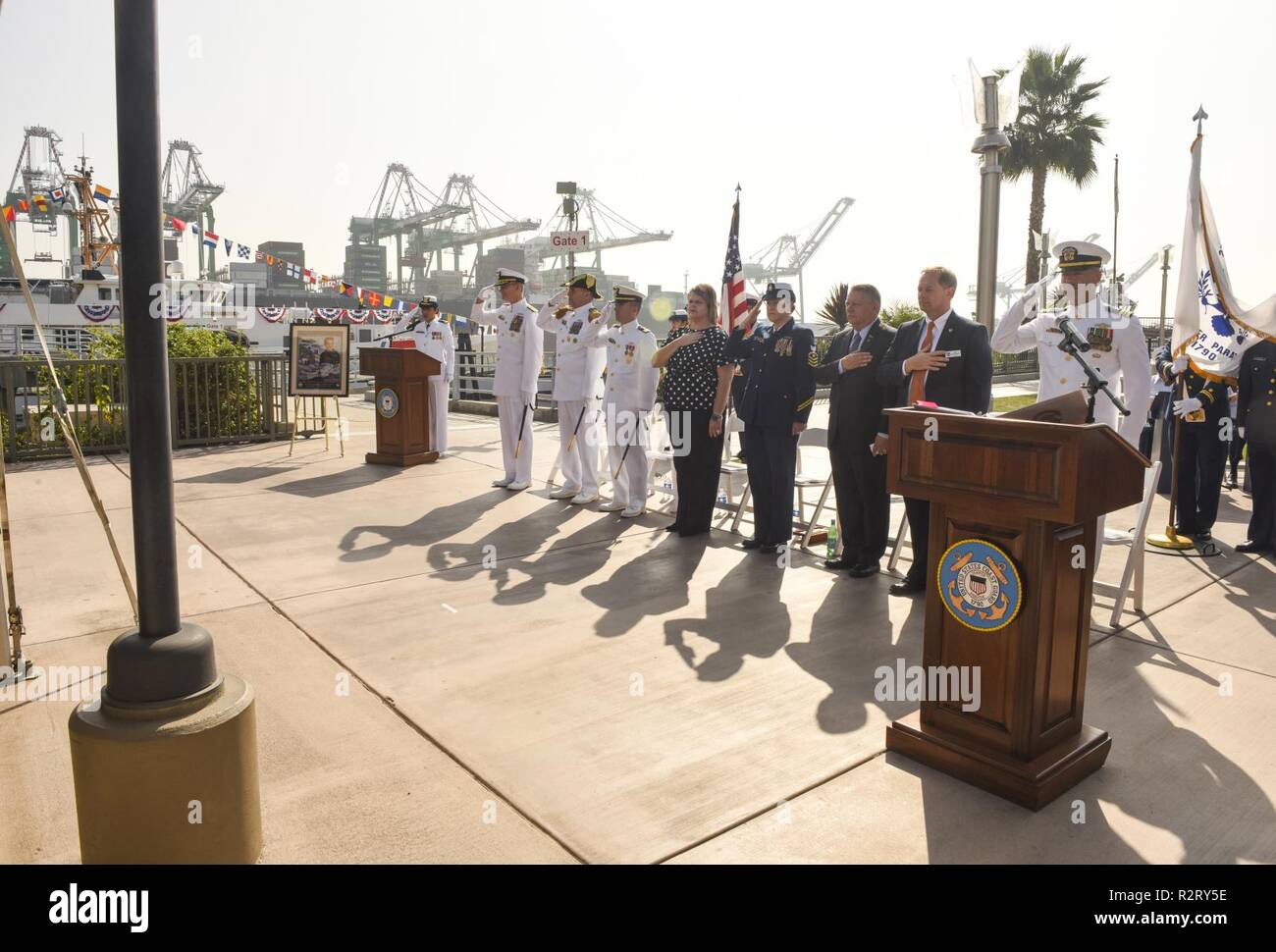 The official party renders a salute during the commissioning ceremony ...