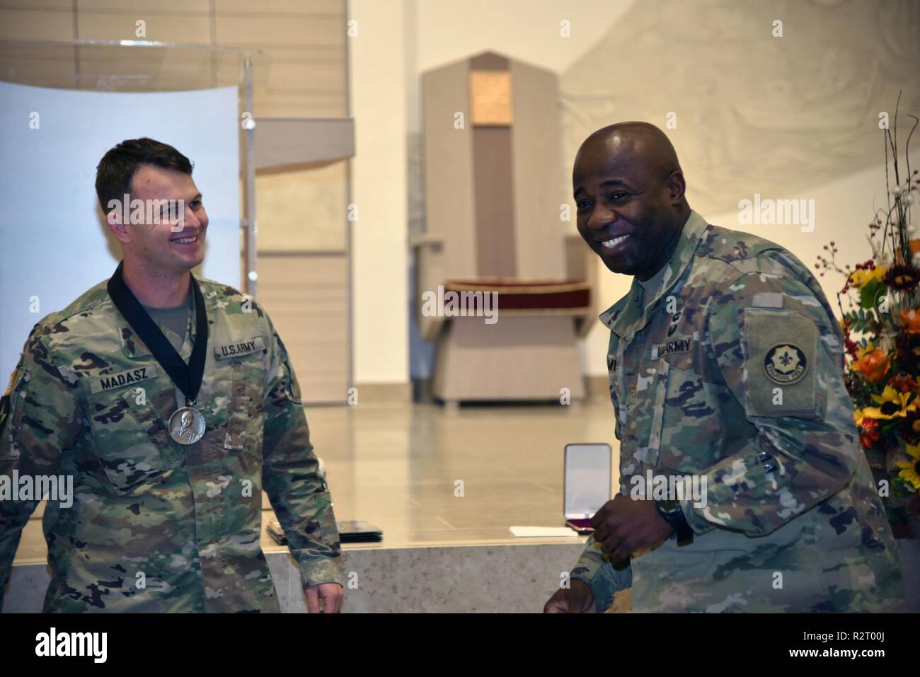 Maj. David Mvondo, 2nd Cavalry Regiment chaplain, congratulates Staff ...