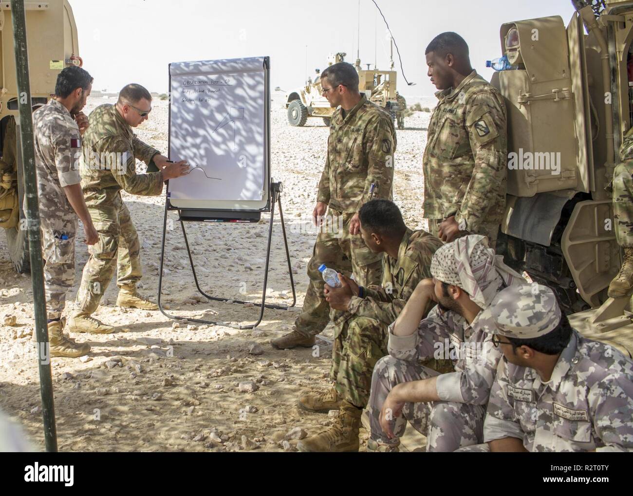 UM HATTAH, Qatar – U.S. Army Staff Sgt. Charlie Billingsley, center, an ...
