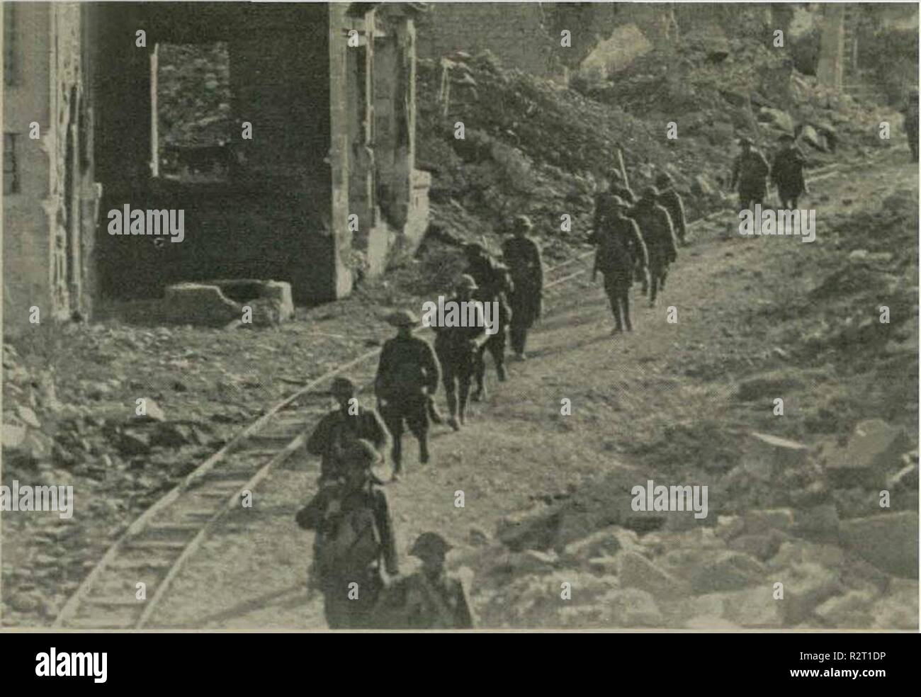 Soldiers with the 28th Division march through the ruins of Varennes ...